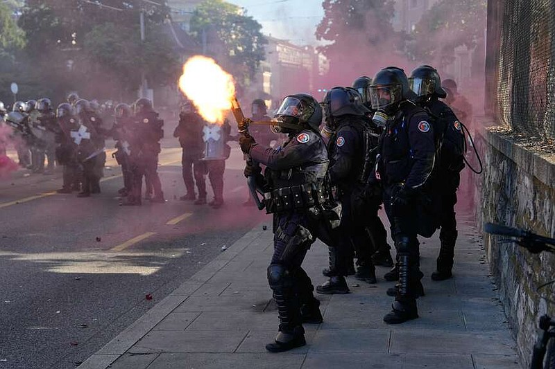 Riot police, protesters clash in Geneva | The Arkansas Democrat-Gazette ...