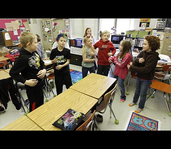 Students learn math by hopping, yelling, twisting and whispering ...