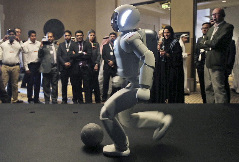 Today's best photos: Honda's robot, Pakistani Christians and Lebanon ...