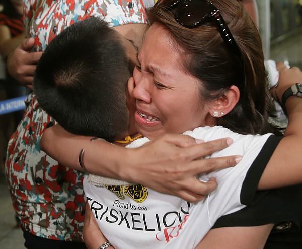 Image of Asia: A hug for a child after a long separation | Chattanooga ...
