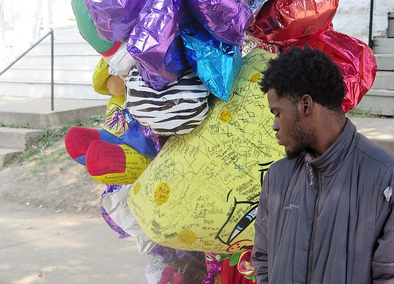 Some seek to swap ad hoc victim shrines for lasting tributes ...