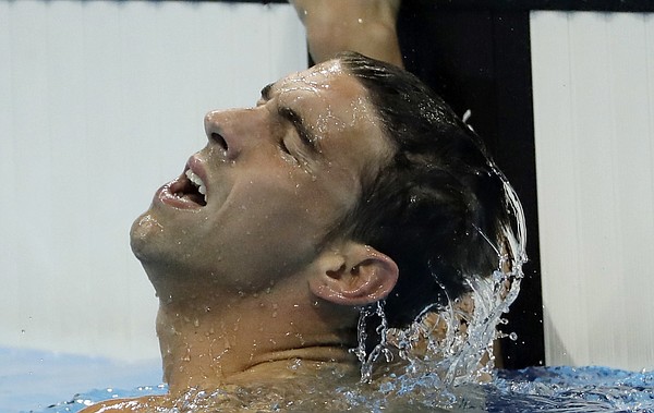 Phelps' formula after late-night finals: pound pasta, sleep ...