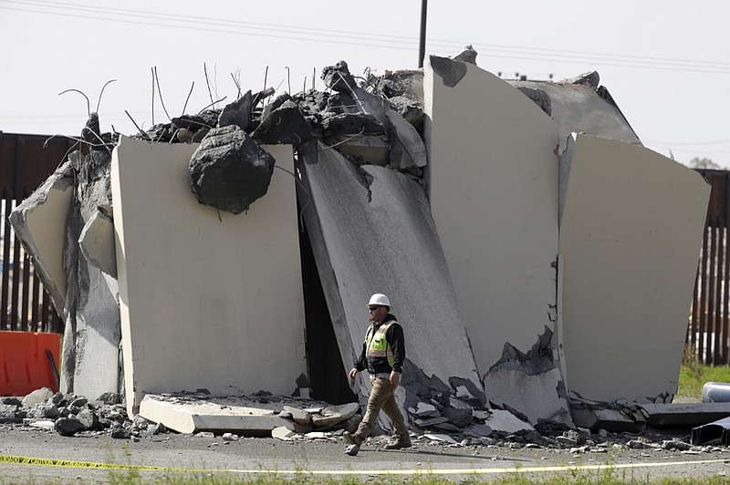 Amid clouds of dust, border wall prototypes are demolished ...