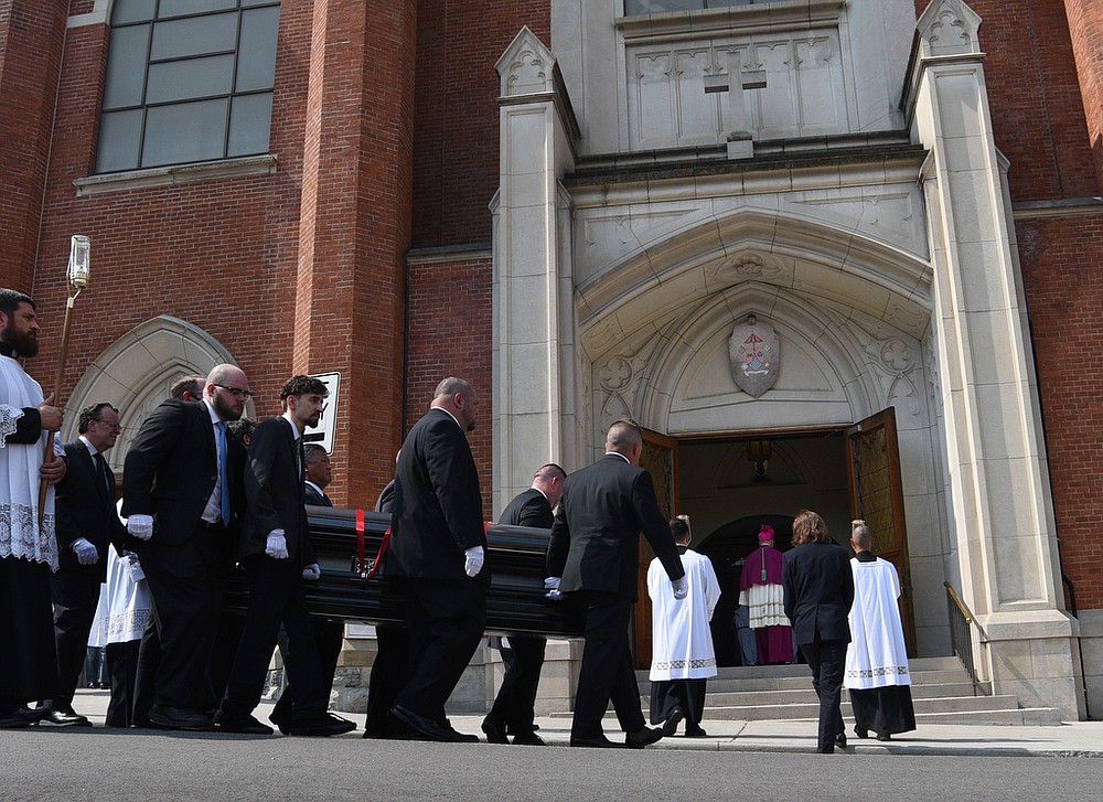 The Rev. Patrick Ryan's remains moved to Catholic church as process for ...