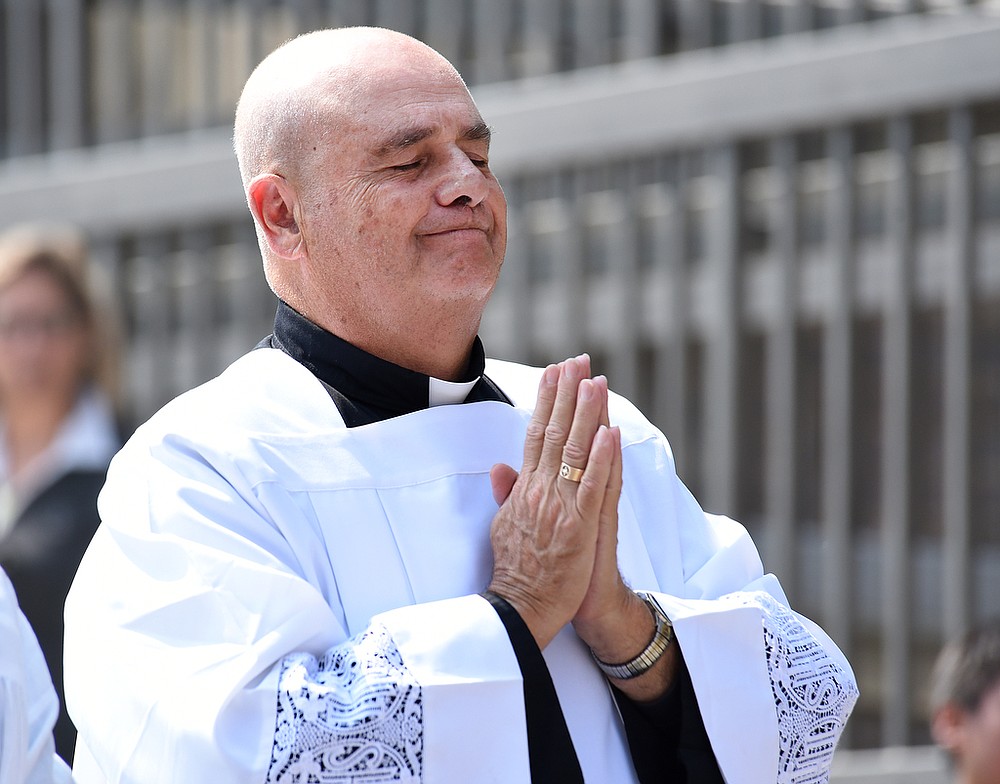 The Rev. Patrick Ryan's remains moved to Catholic church as process for ...