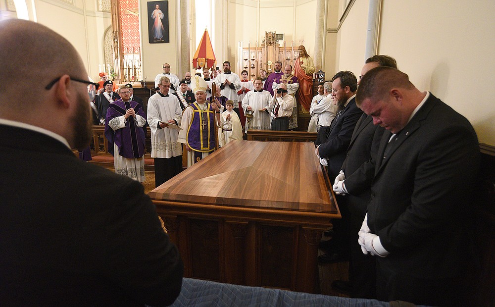 The Rev. Patrick Ryan's remains moved to Catholic church as process for ...