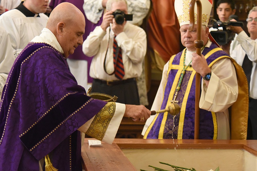 The Rev. Patrick Ryan's remains moved to Catholic church as process for ...